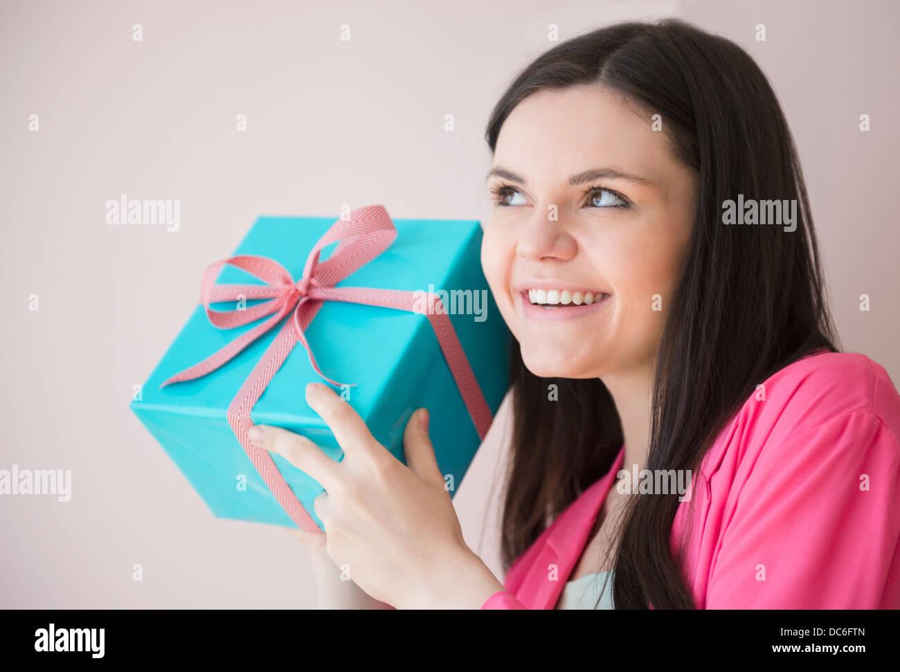 happy woman with gift box Stock Photo - Alamy