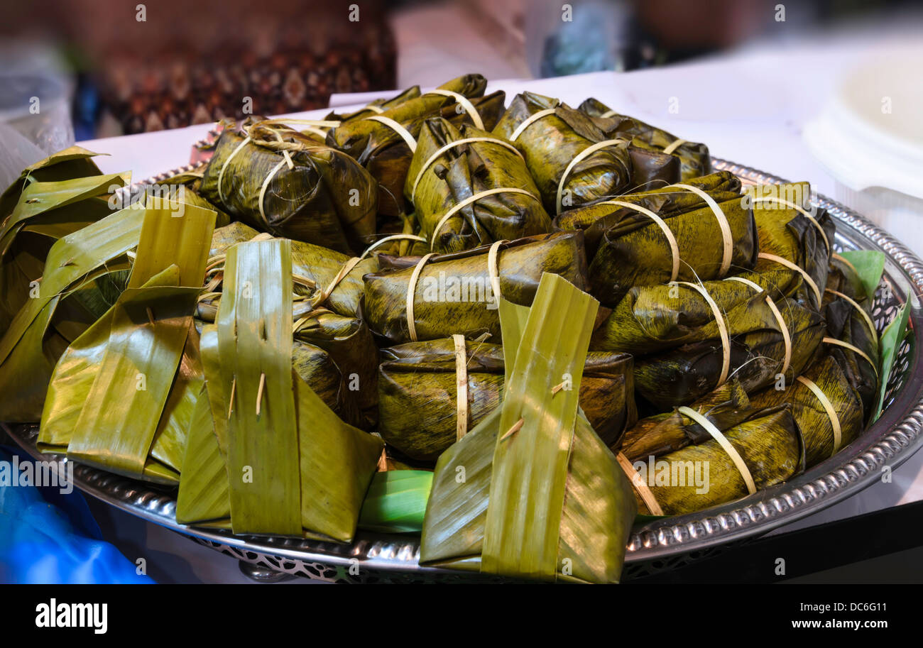 Thailand dessert wrapped in banana leaf in restaurant Stock Photo - Alamy