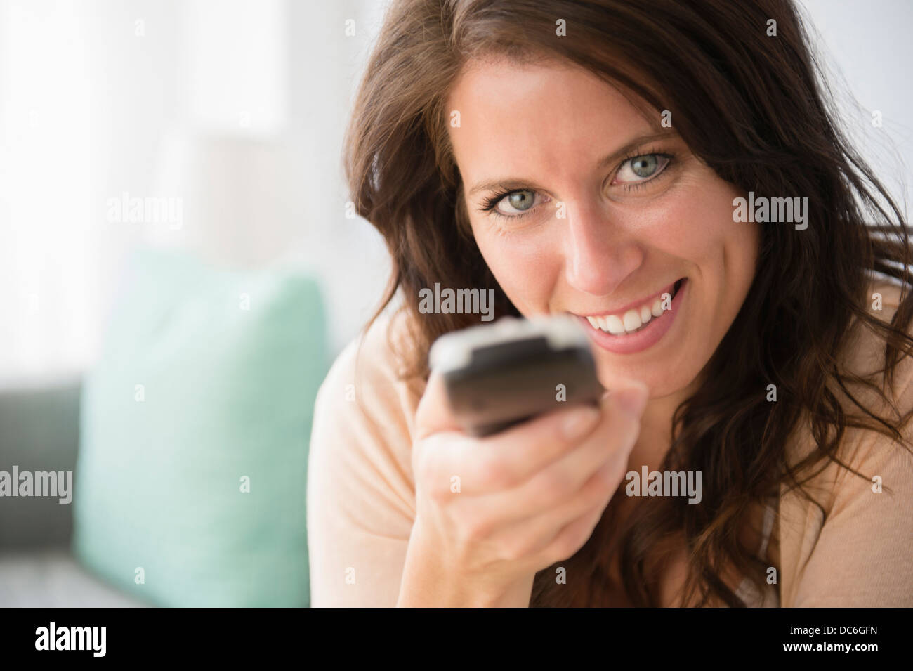 Woman remote control hi-res stock photography and images - Alamy