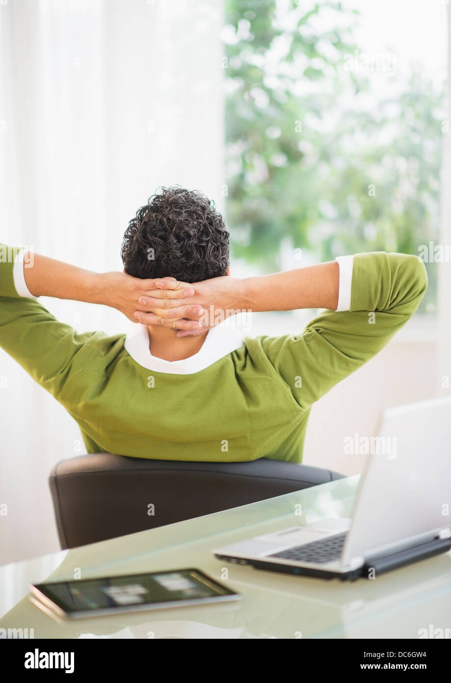 Rear view of man taking break from work Stock Photo - Alamy