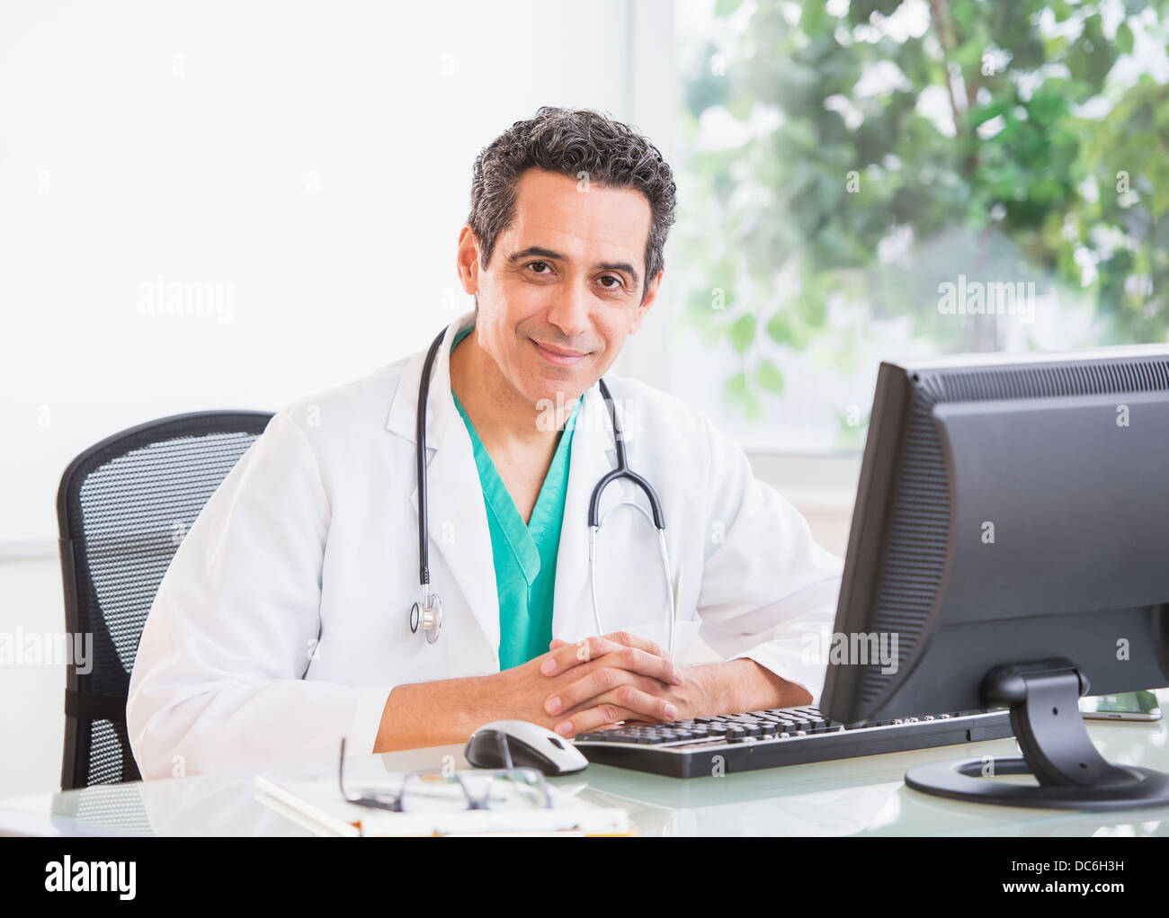 Portrait of doctor in office Stock Photo - Alamy