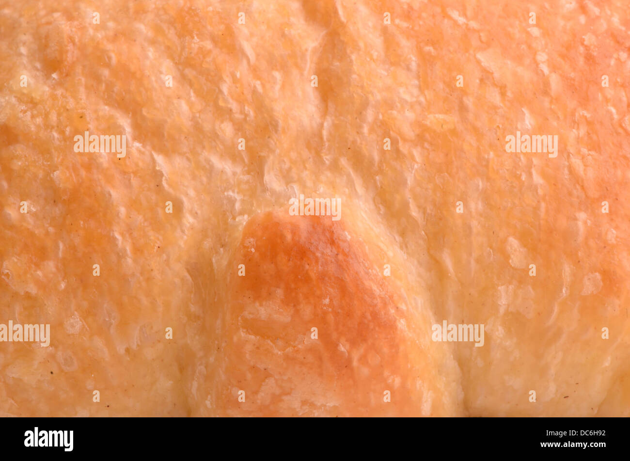 A closeup image of the golden flakey crust of a croissant Stock Photo ...