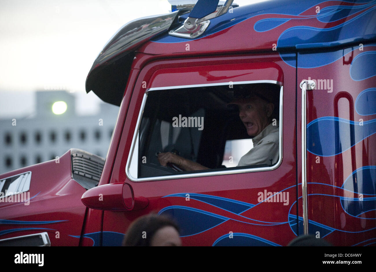 Detroit, Michigan, USA. 9th Aug, 2013. A crew member makes a face while ...