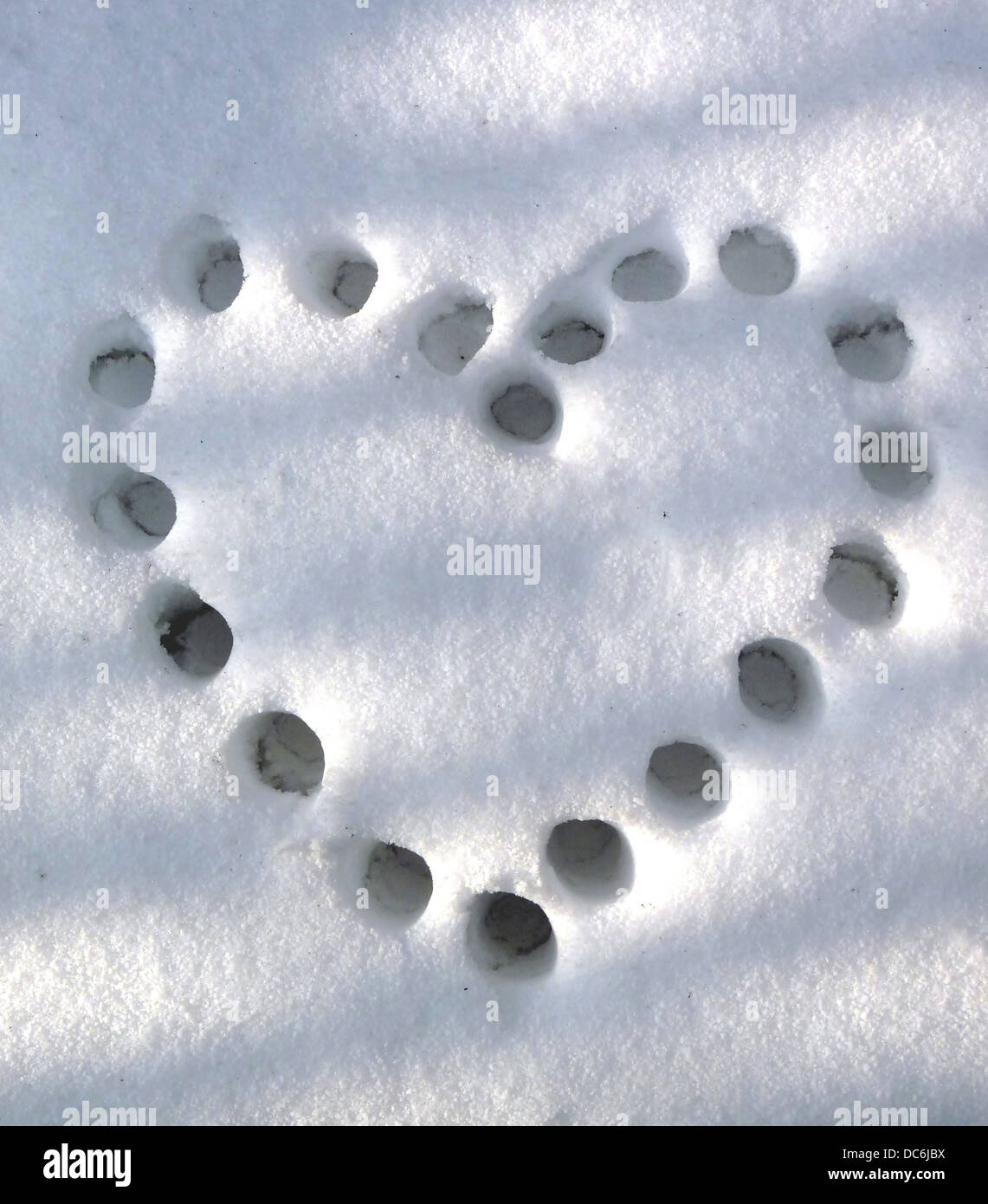 snow heart shape Stock Photo - Alamy