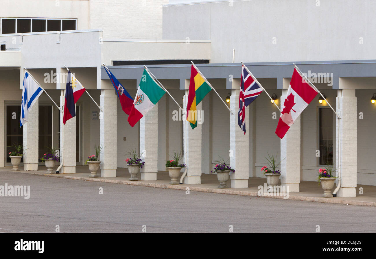 Flags of multiple countries displayed on a building front Stock Photo ...