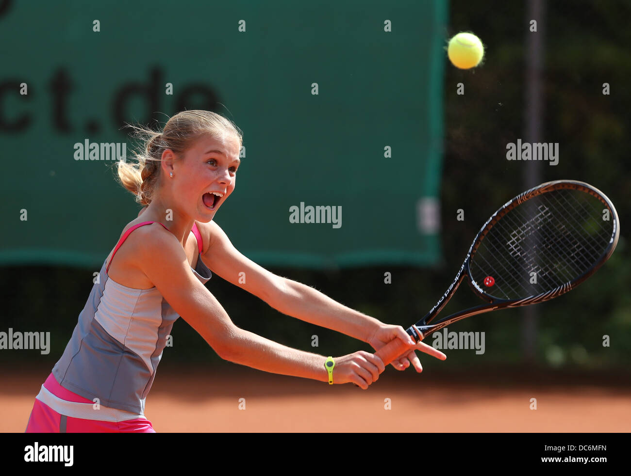 Young girl playing tennis Stock Photo - Alamy