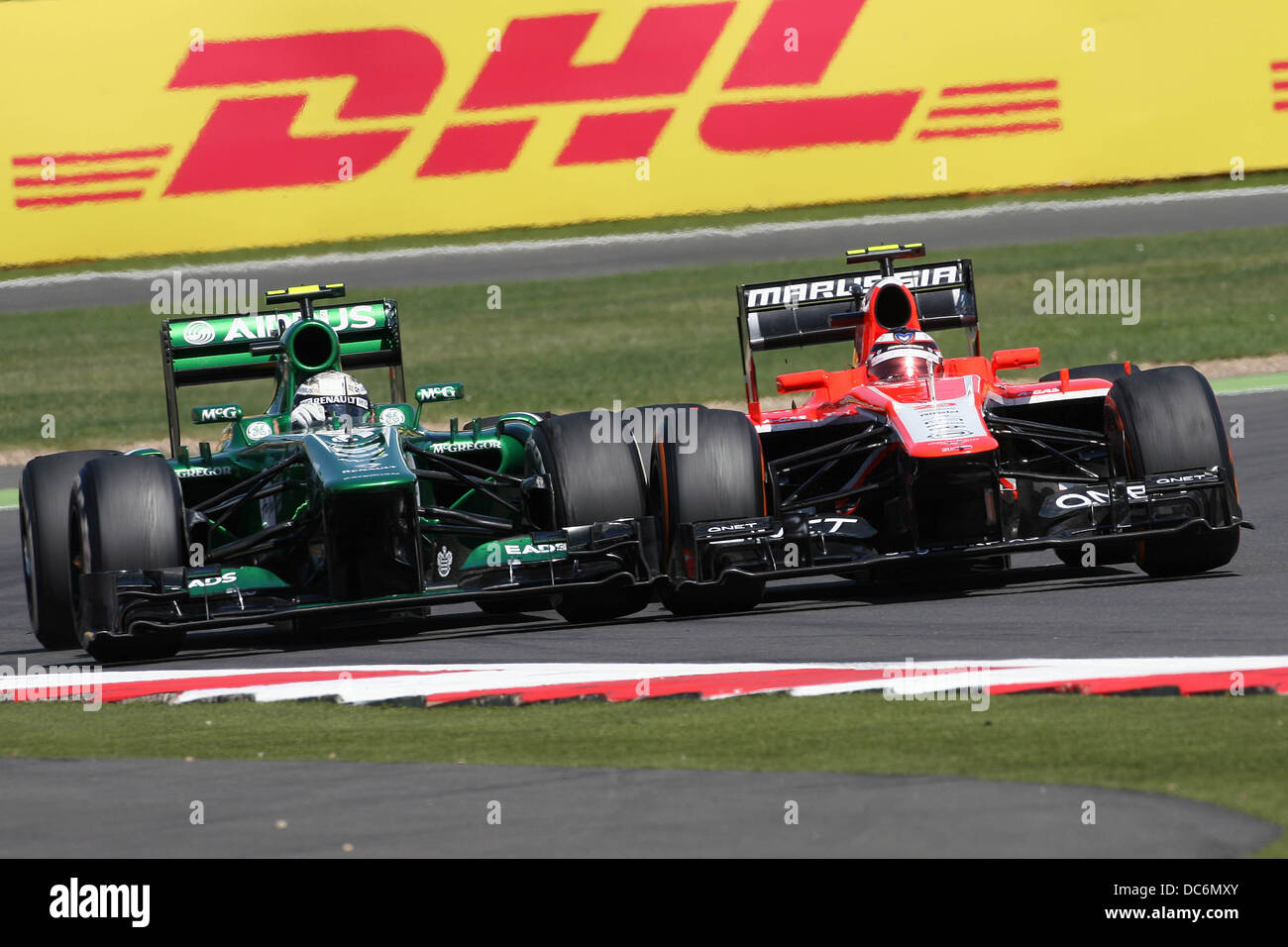 Caterham f1 battles with jules bianchis marussia f1 hi-res stock ...
