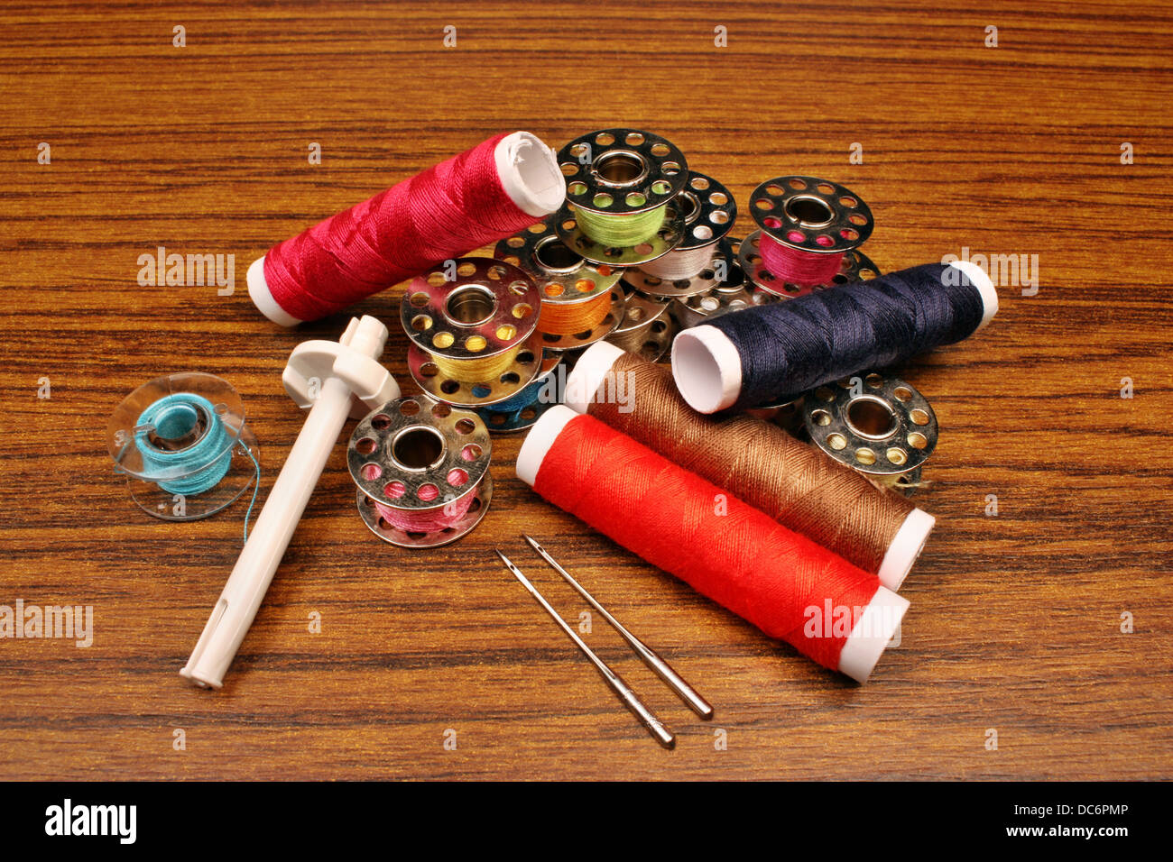 Thread sewing machine colors in the table Stock Photo - Alamy