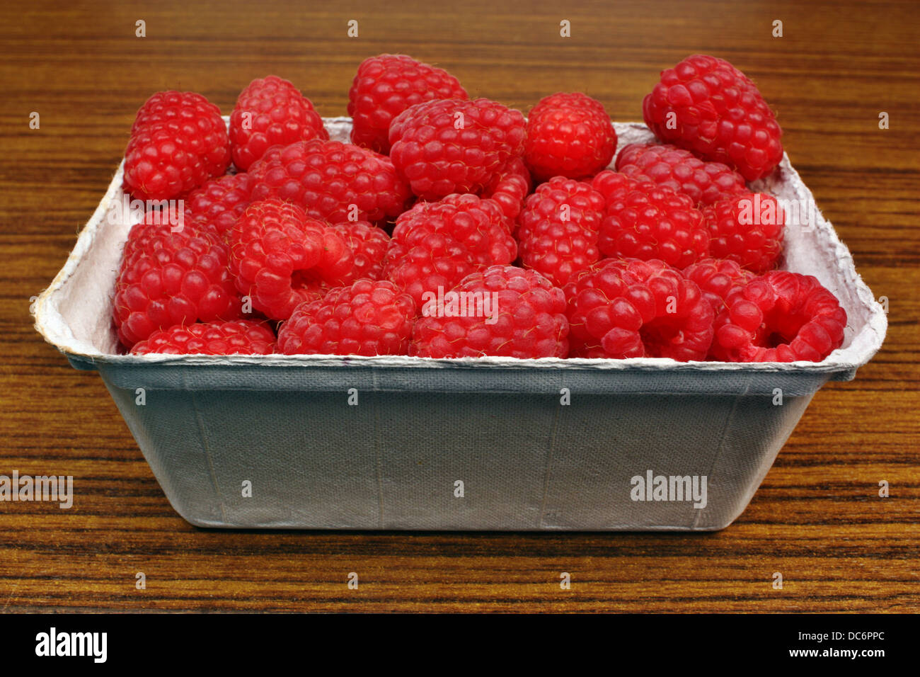 Raspberries in paper box hi-res stock photography and images - Alamy