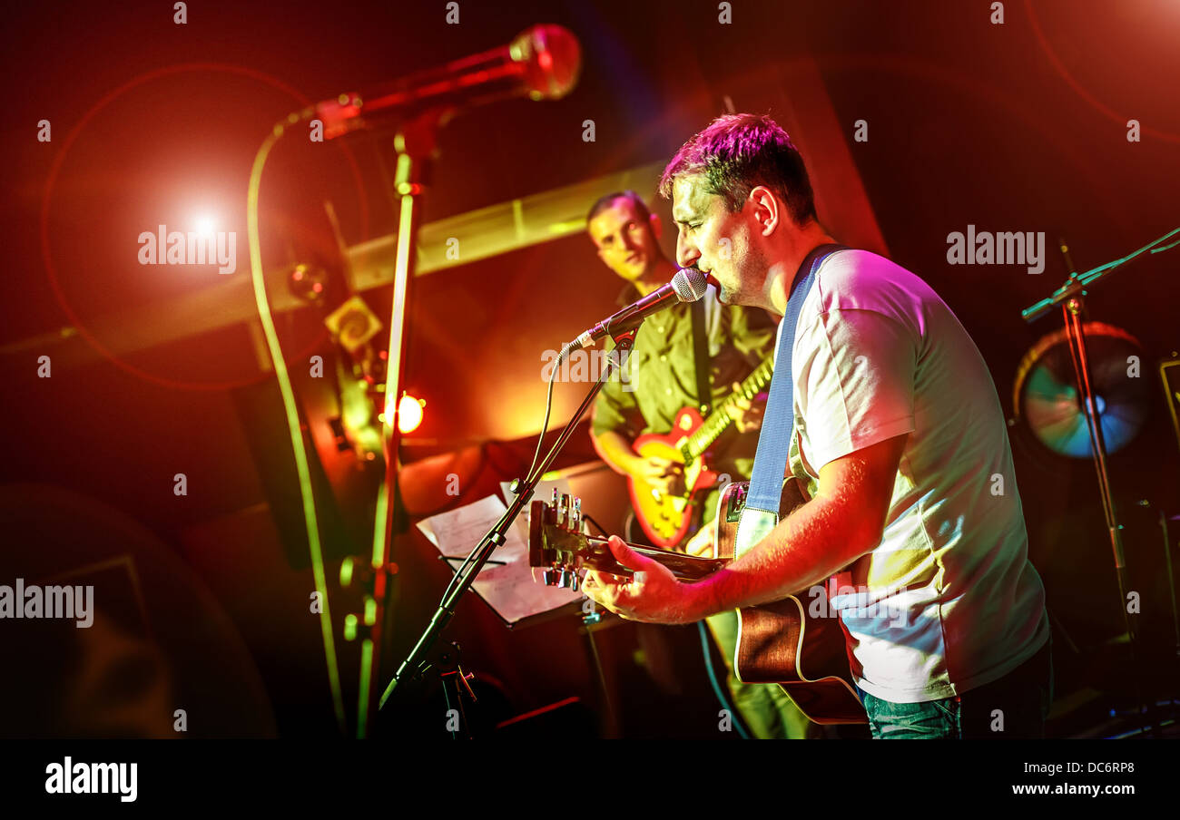 Band performs on stage, rock music concert Stock Photo - Alamy