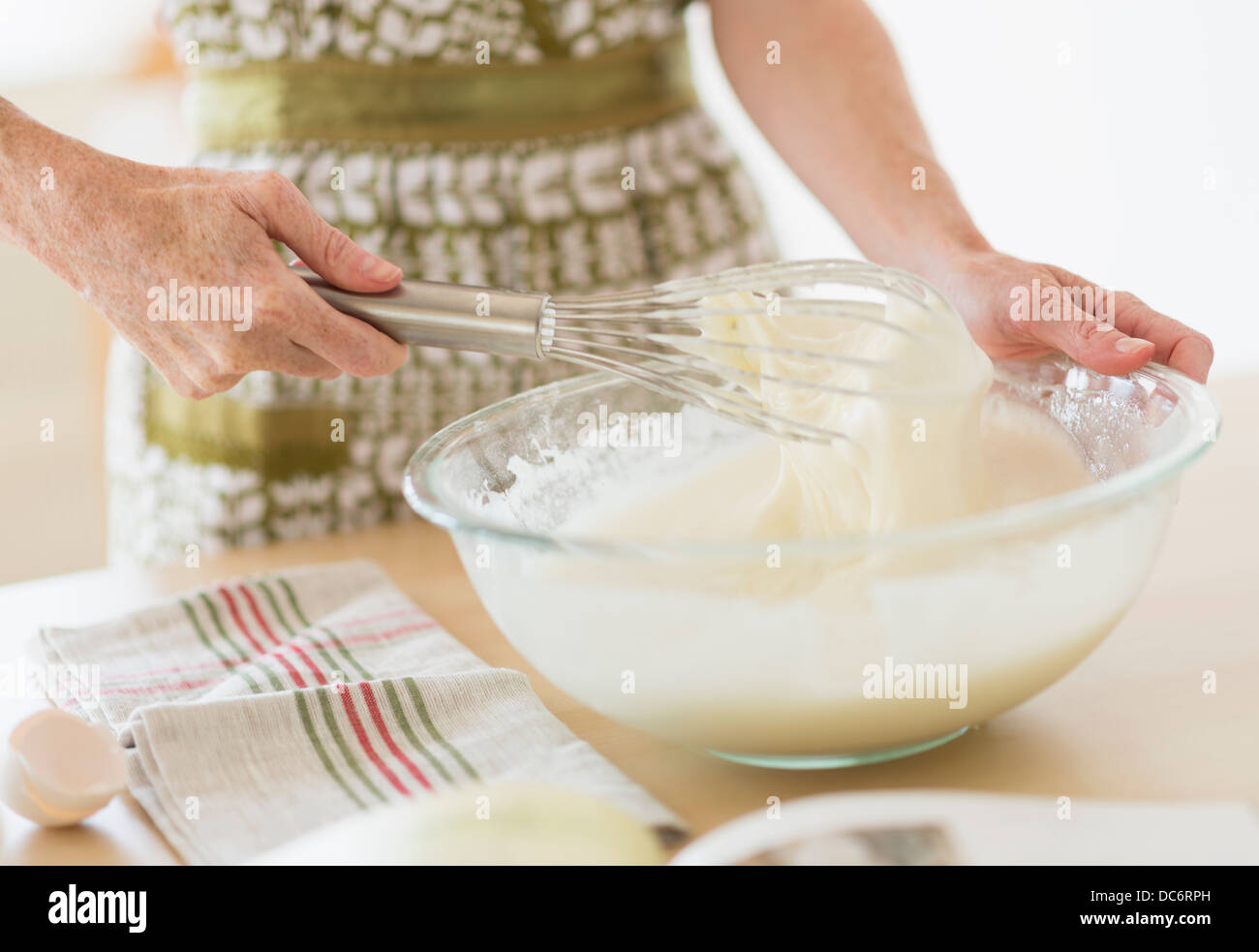 Midsection of woman whisking batter Stock Photo - Alamy