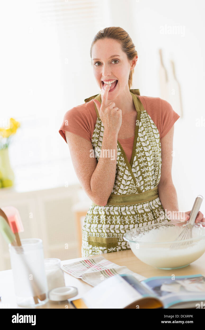 Woman cooking in kitchen Stock Photo - Alamy