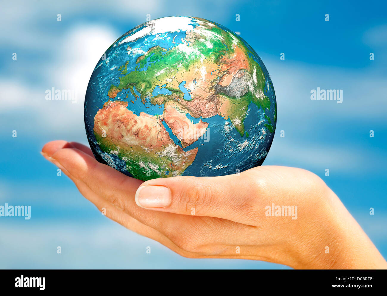 Human hand holding a globe Stock Photo - Alamy
