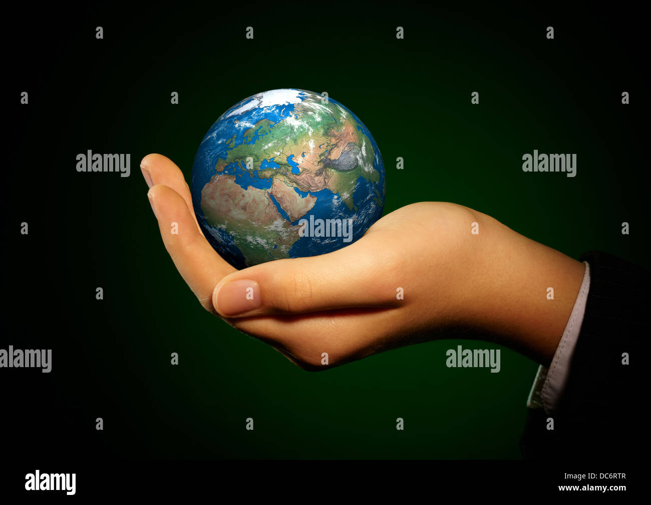 Human hand holding a globe Stock Photo - Alamy