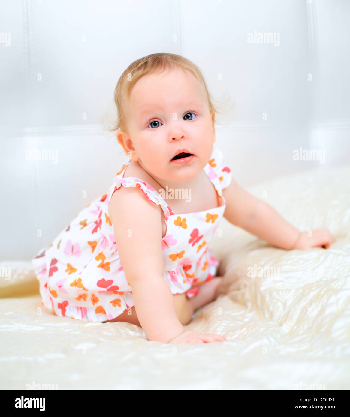 one years old baby girl on a light background Stock Photo - Alamy