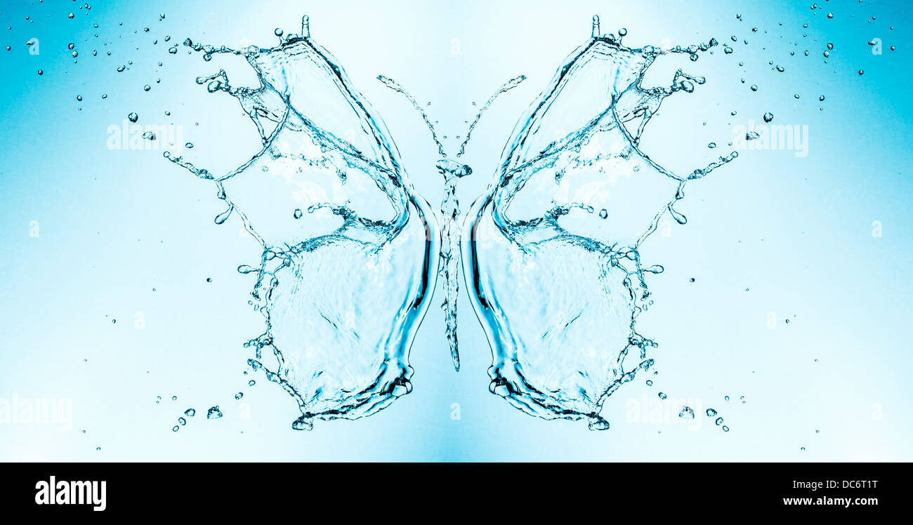 Butterfly splashing water on blue background Stock Photo - Alamy