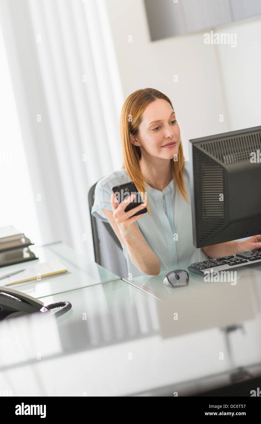 Latin young woman work office computer hi-res stock photography and ...