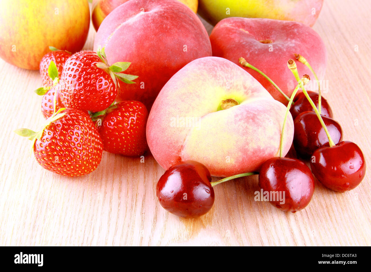 Summer fruits - cherries, strawberries, peaches, apples and mango ...
