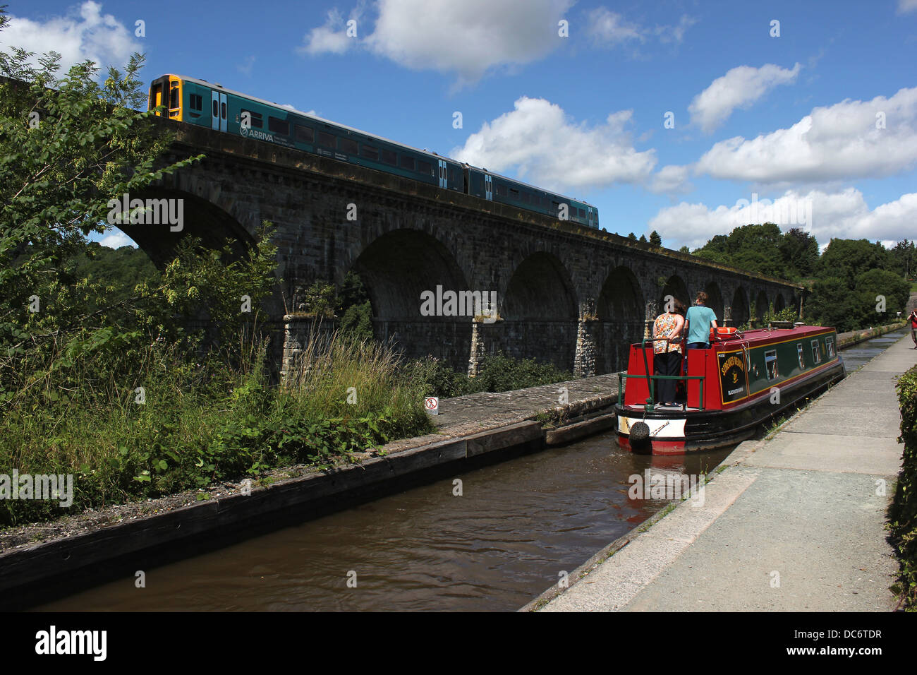 Narrowboat and train Stock Photo - Alamy