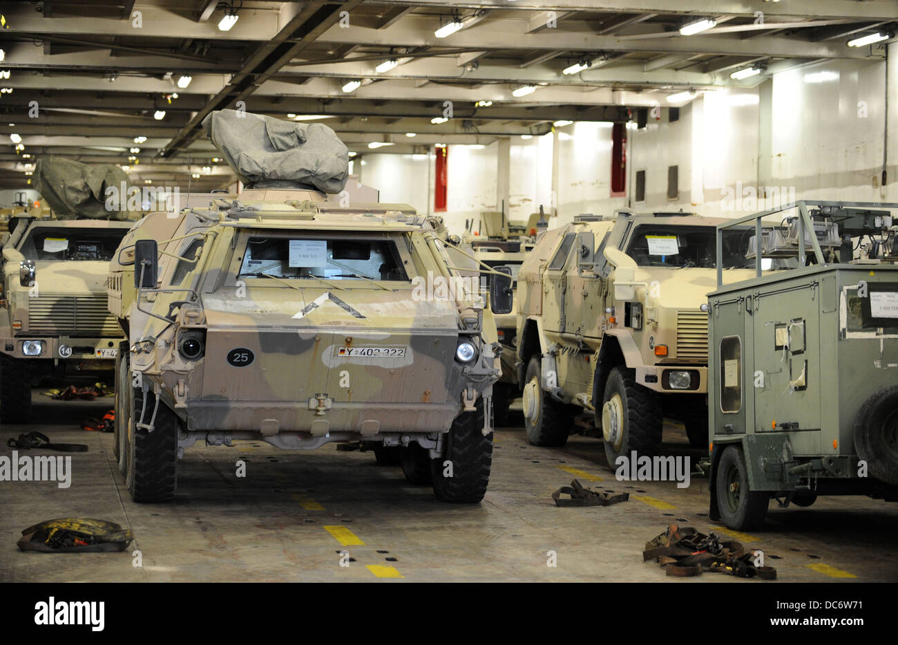 Armored military vehicles of the Bundeswehr are unloaded from the deck ...