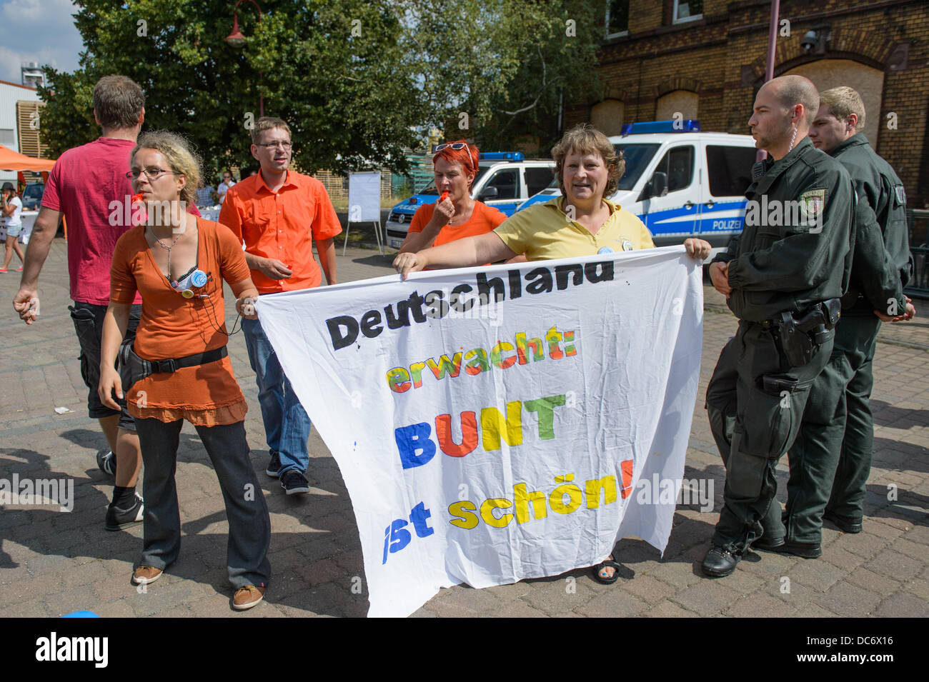 Demonstrators protest against right-wing extremism with a banner with ...