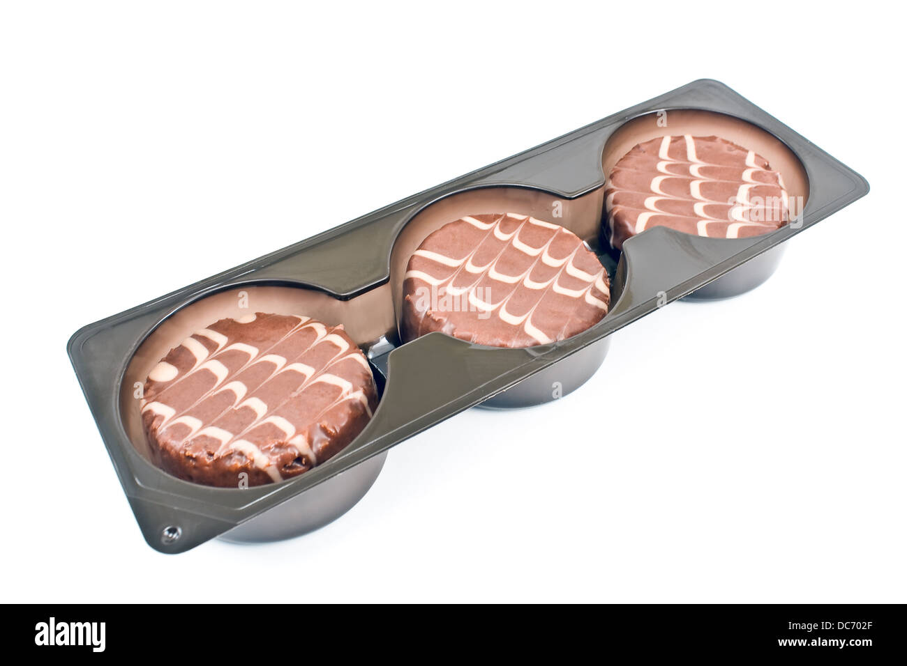 Packed chocolate cake isolated on white background Stock Photo - Alamy