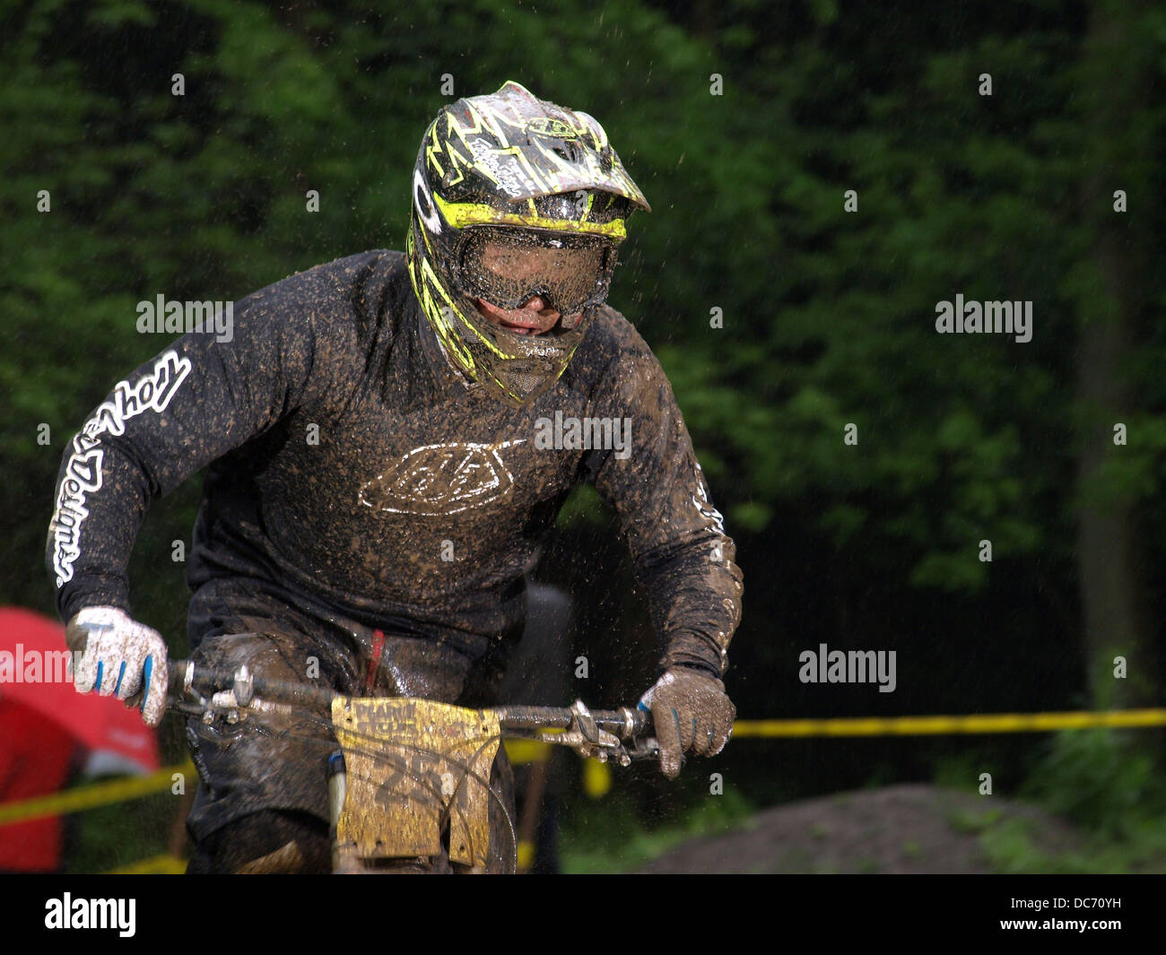 Muddy mountain biker Stock Photo - Alamy