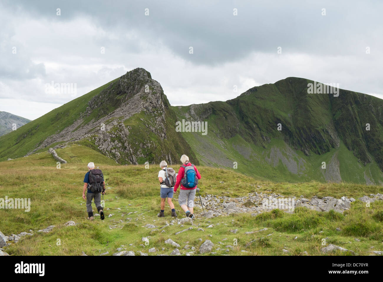 Walkers on Y Garn walking towards Mynydd Drws-y-coed on Nantlle ridge ...