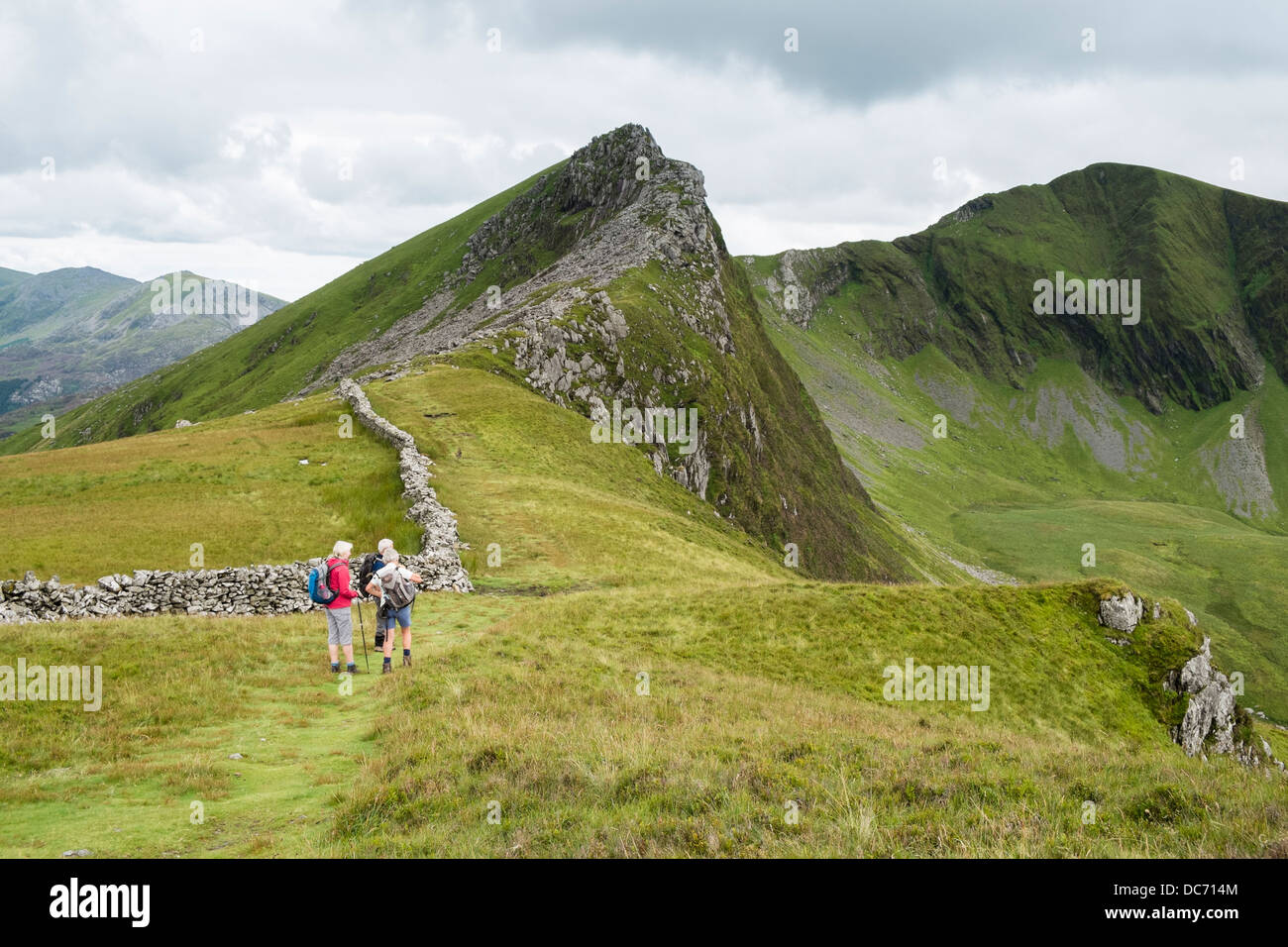 Walkers on Y Garn walking towards Mynydd Drws-y-coed on Nantlle ridge ...