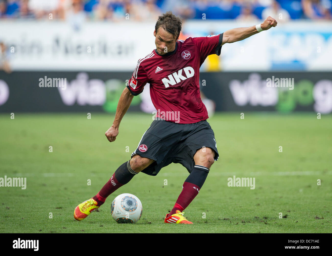 Sinsheim, Germany. 10th Aug, 2013. Nuremberg's Markus Feulner kicks the ...