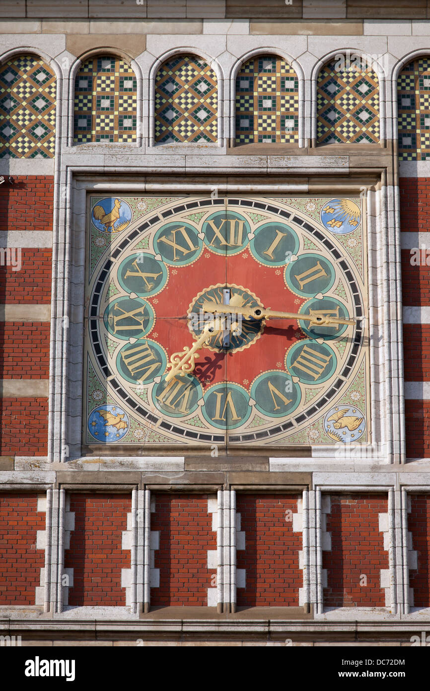 Clock on the Amsterdam Central Train Station historic facade, Holland ...