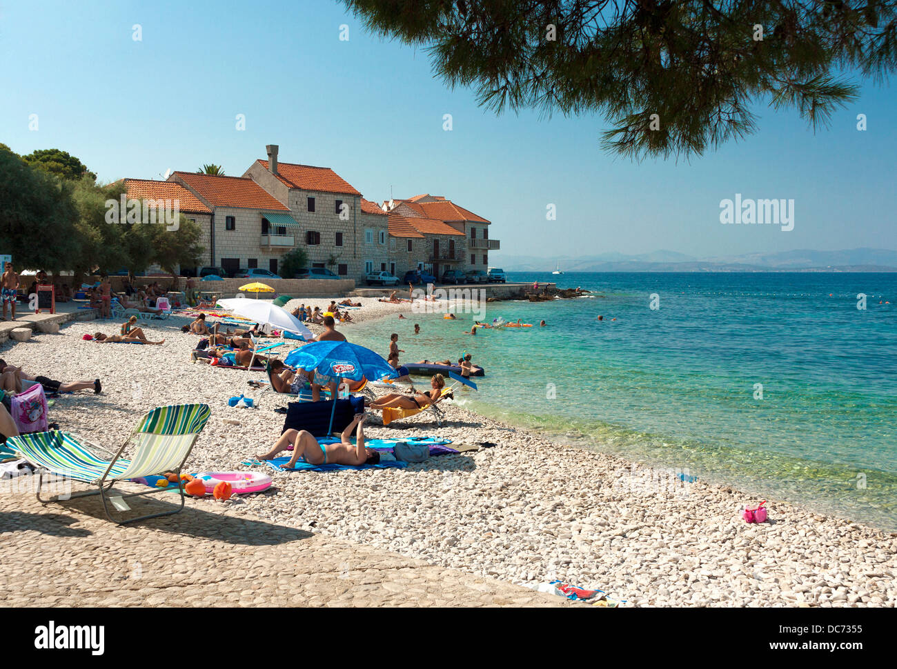 Tourists on beach in Sutivan, Croatia Stock Photo - Alamy