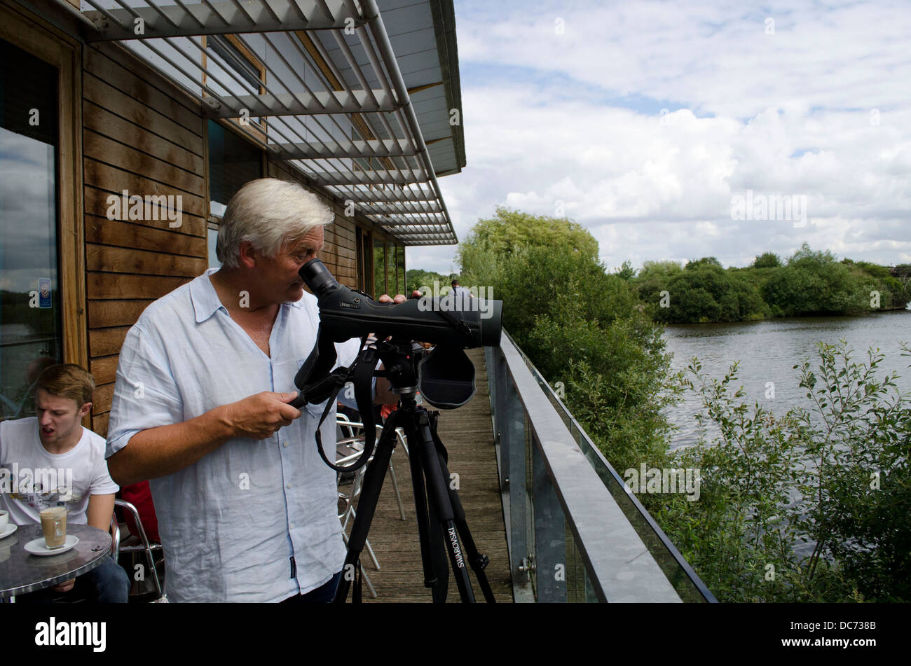 Watching through a scope Stock Photo - Alamy
