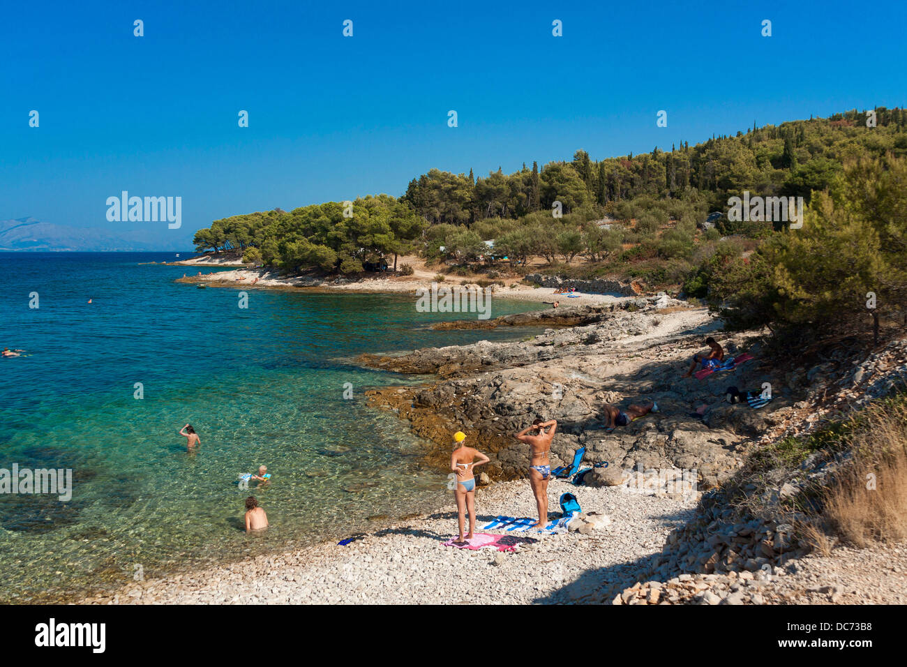 Tourists on a beach near Sutivan village, Croatia Stock Photo - Alamy
