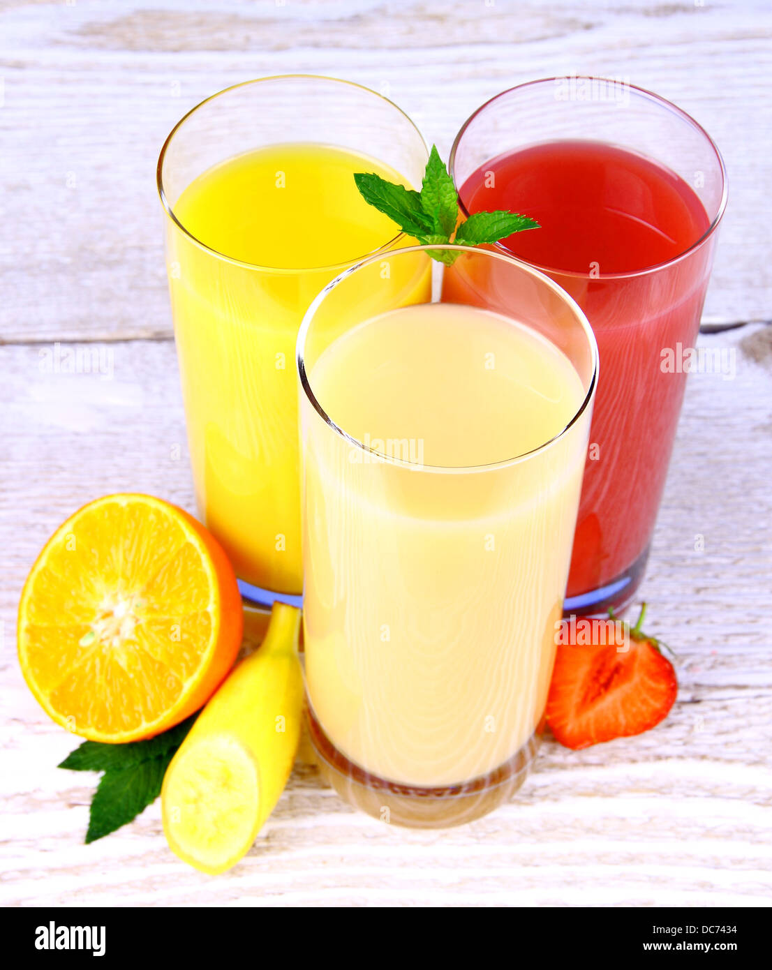 Bananas, strawberry and oranges slice, juice in glass, top view Stock ...