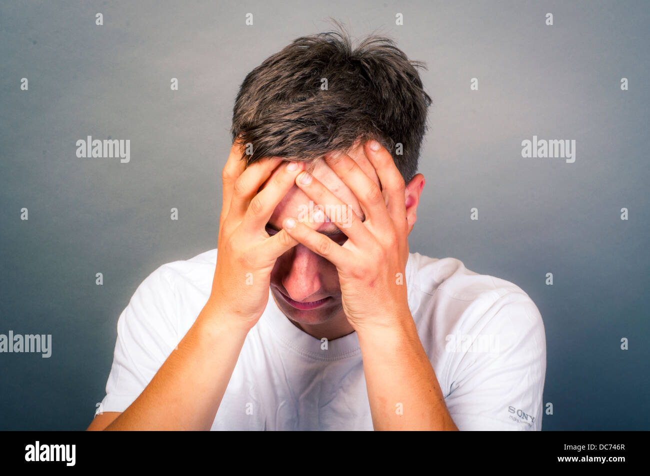 an image of upset young man Stock Photo - Alamy