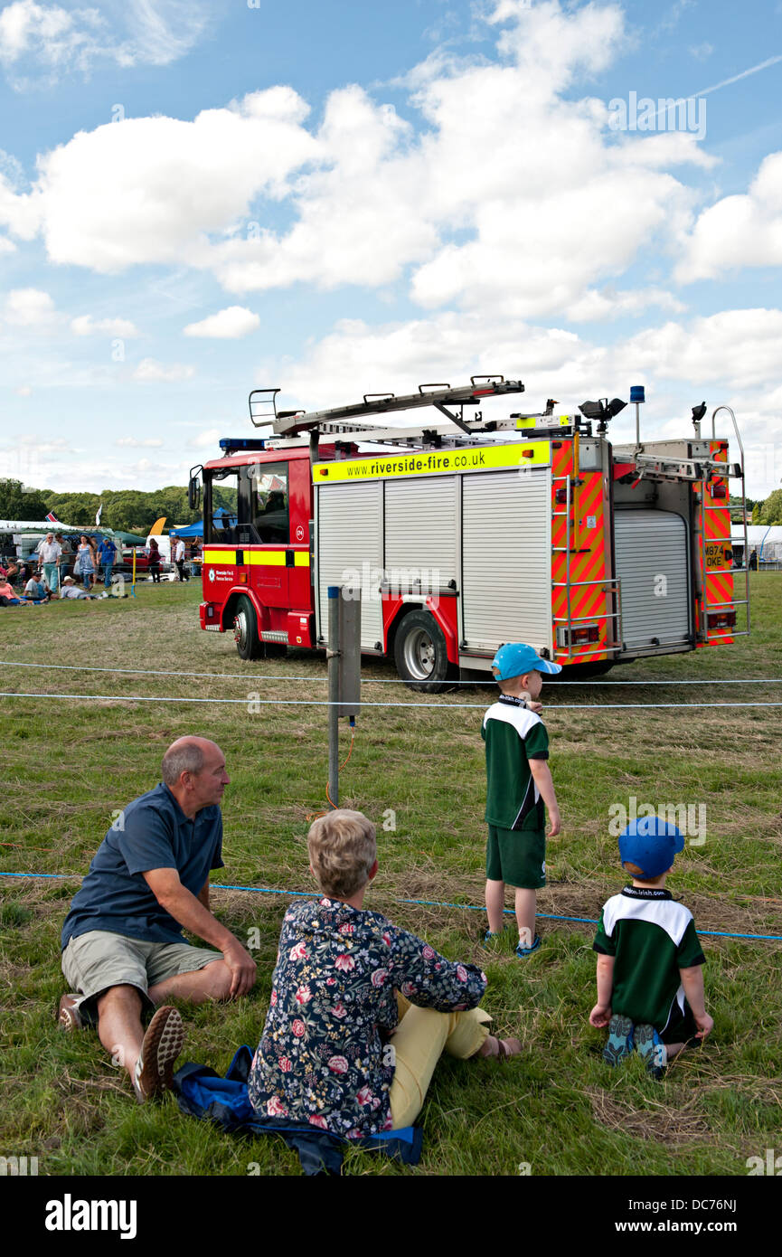 Spectators watch as a fire appliance is displayed at a transport fair ...