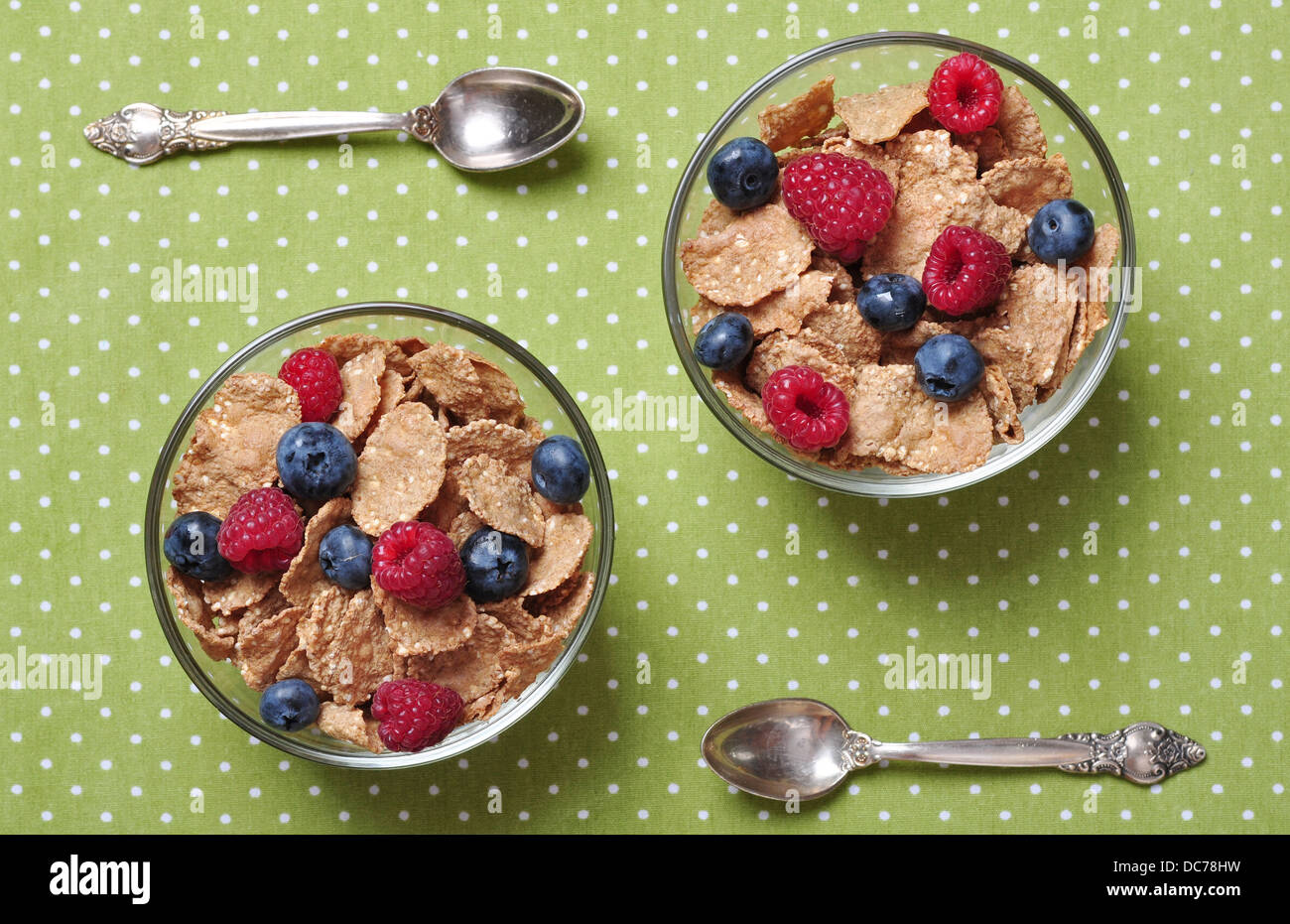 cereal flakes with raspberry and blueberry in glass bowl Stock Photo ...