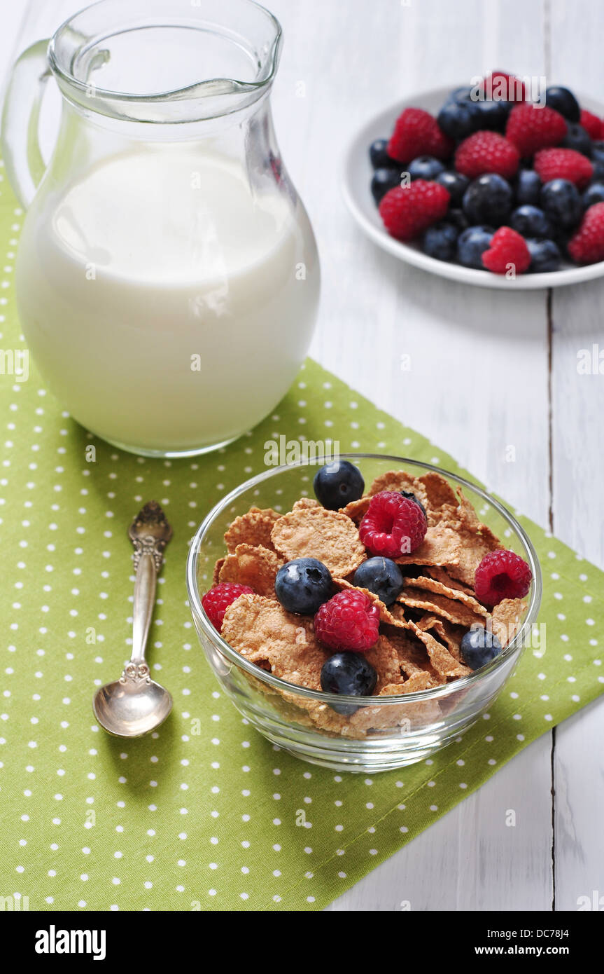 cereal flakes with raspberry and blueberry in glass bowl Stock Photo ...