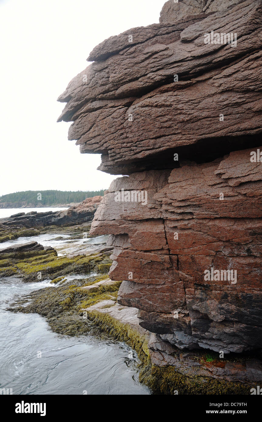 Rock face off the coast of Maine on an overcast day at low tide Stock ...