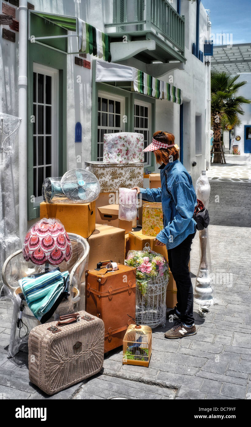 Shopkeeper goods sale in shop hi-res stock photography and images - Alamy