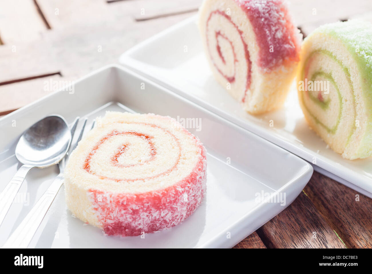 Set of colorful jam rolls with spoon and fork, stock photo Stock Photo ...