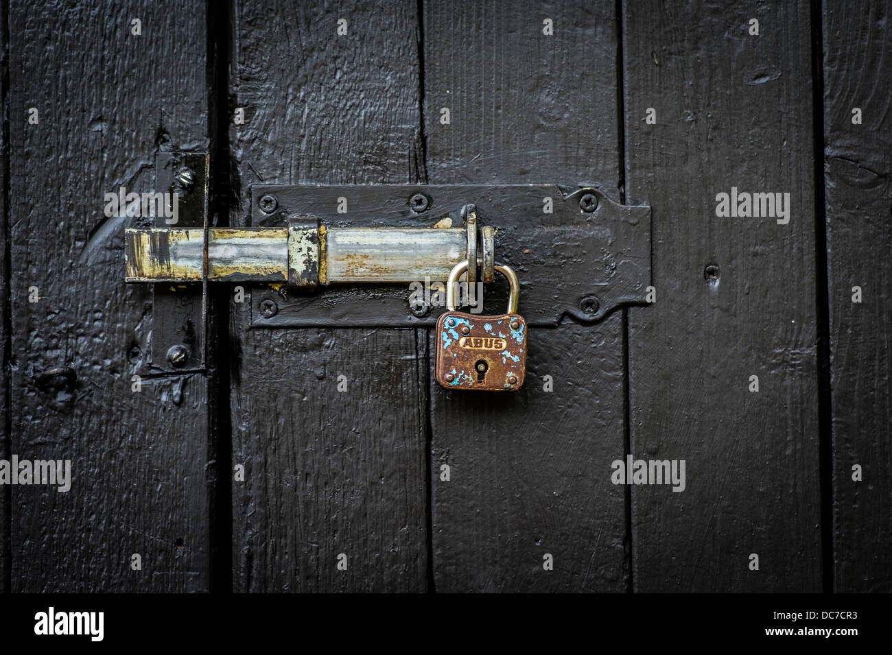 Padlock and Clasp on Black Wooden Door Stock Photo - Alamy