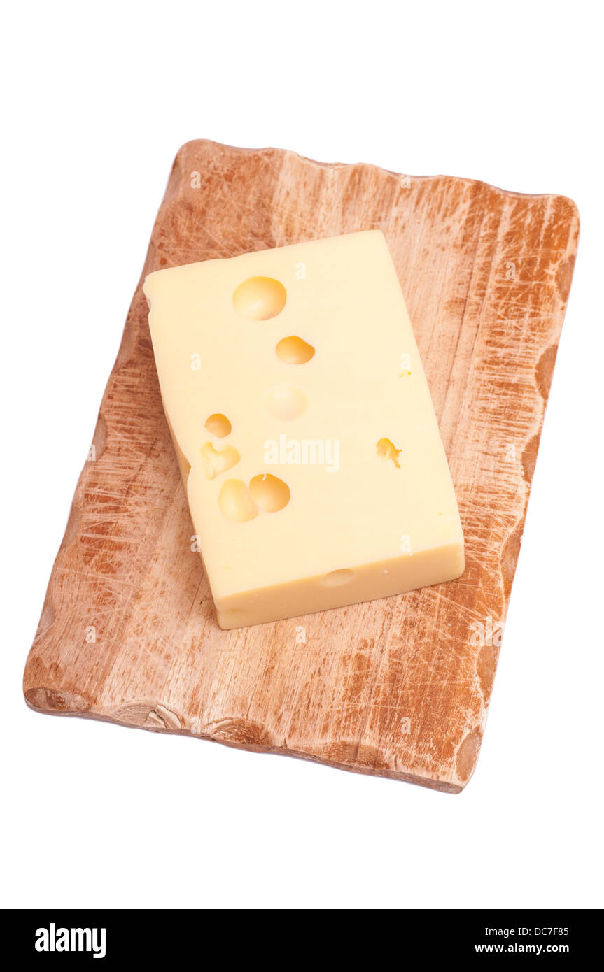 Emmenthaler cheese on wooden board and white background Stock Photo - Alamy