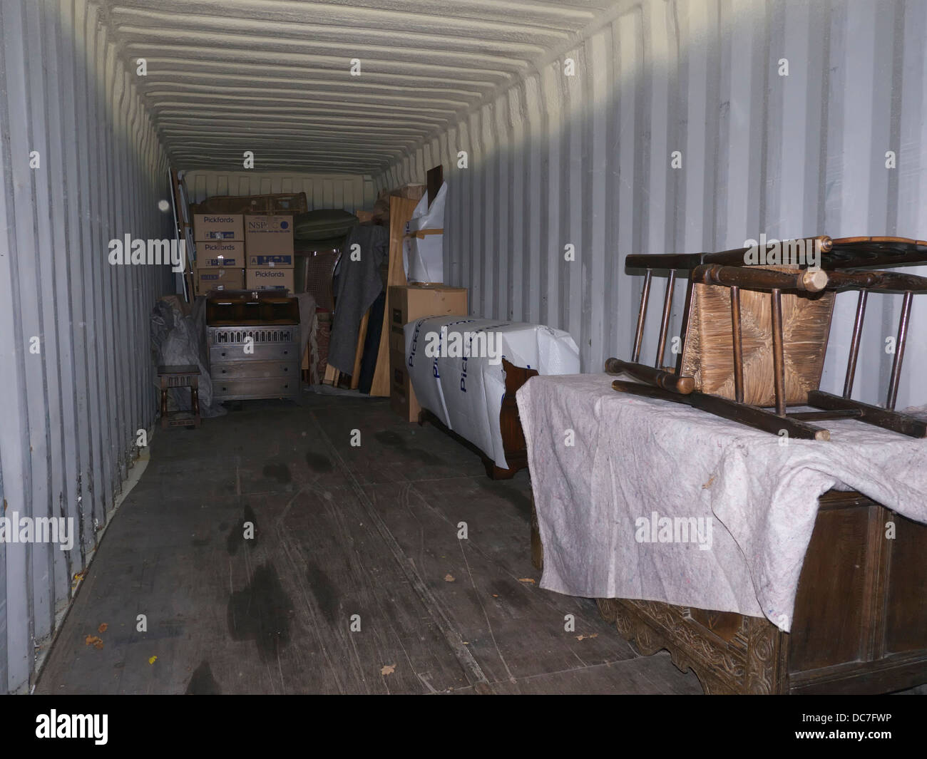 Filling the storage container Stock Photo - Alamy