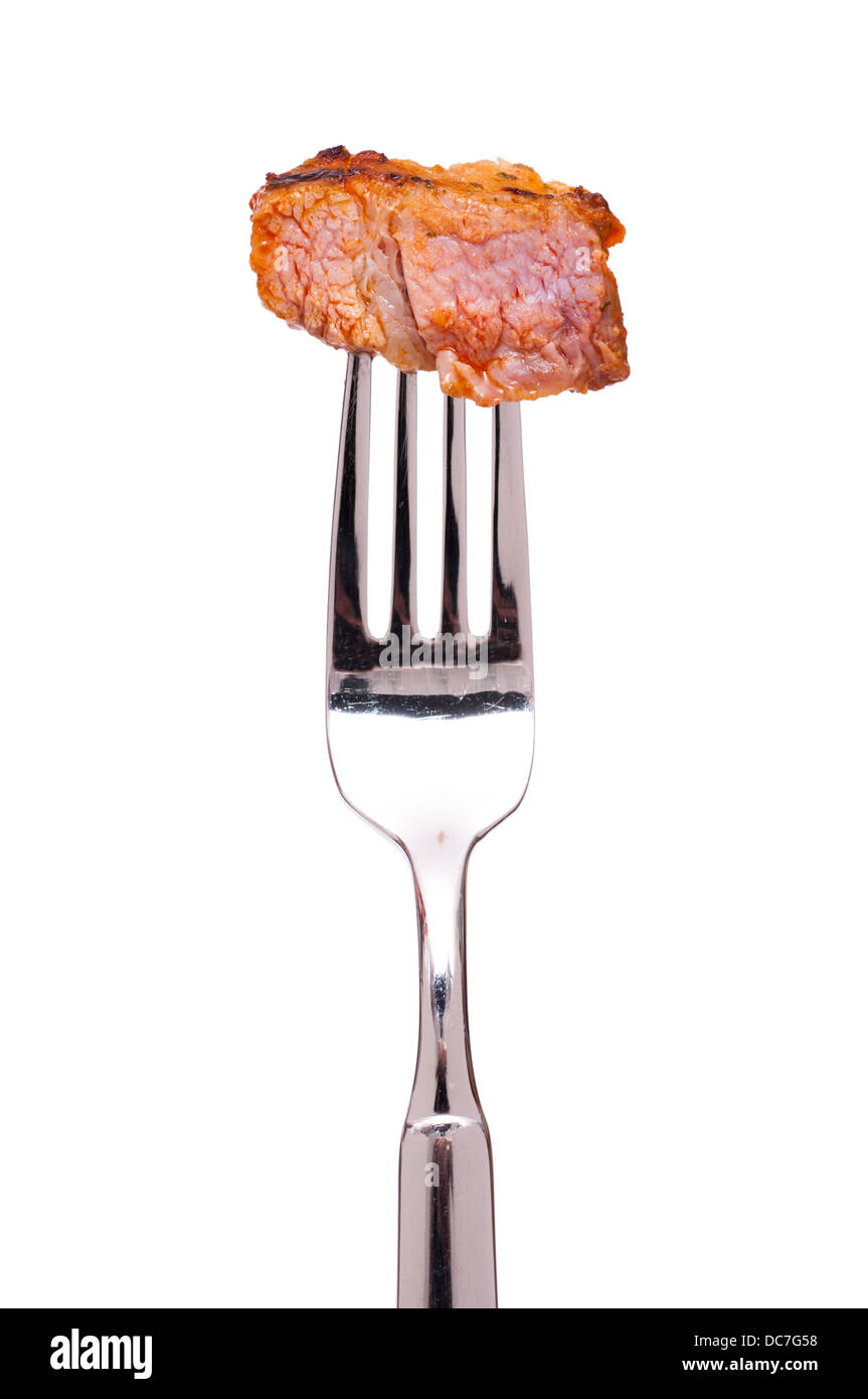 White isolated grilled scrag of pork on a fork Stock Photo - Alamy