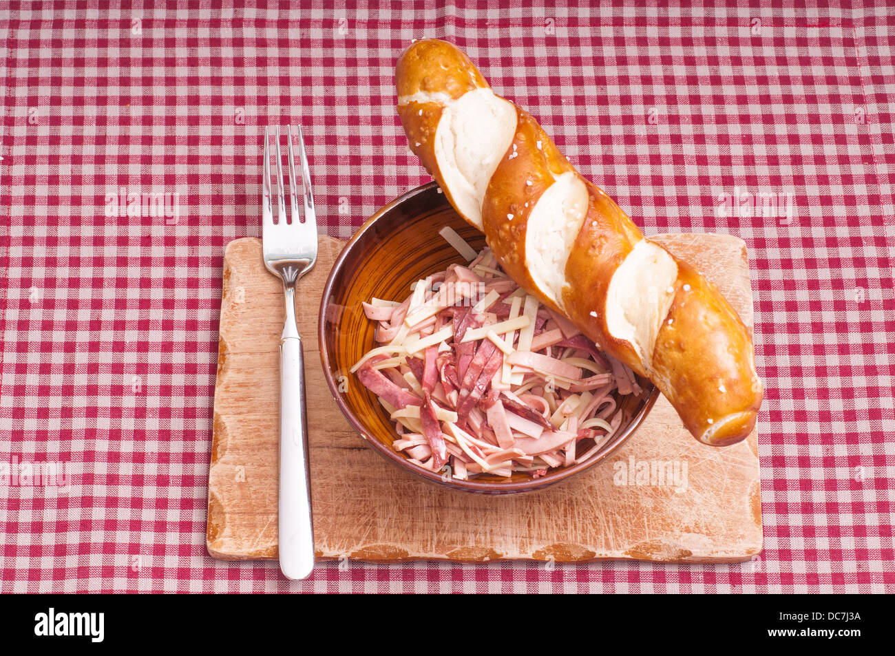 Sausage salad with emmenthaler cheese and sausages in bowl Stock Photo ...