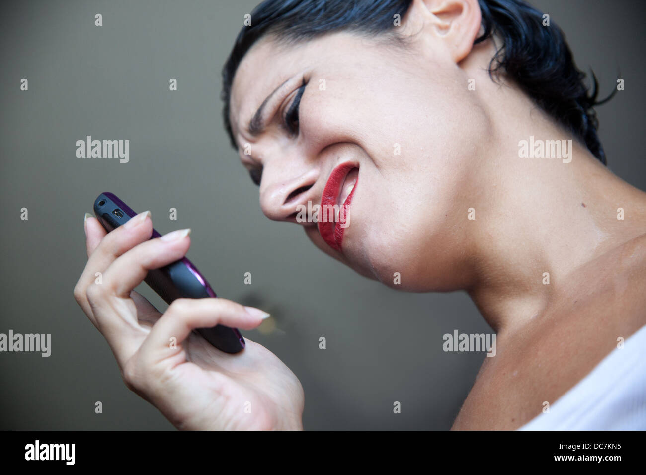 woman stressed by her mobile phone Stock Photo - Alamy