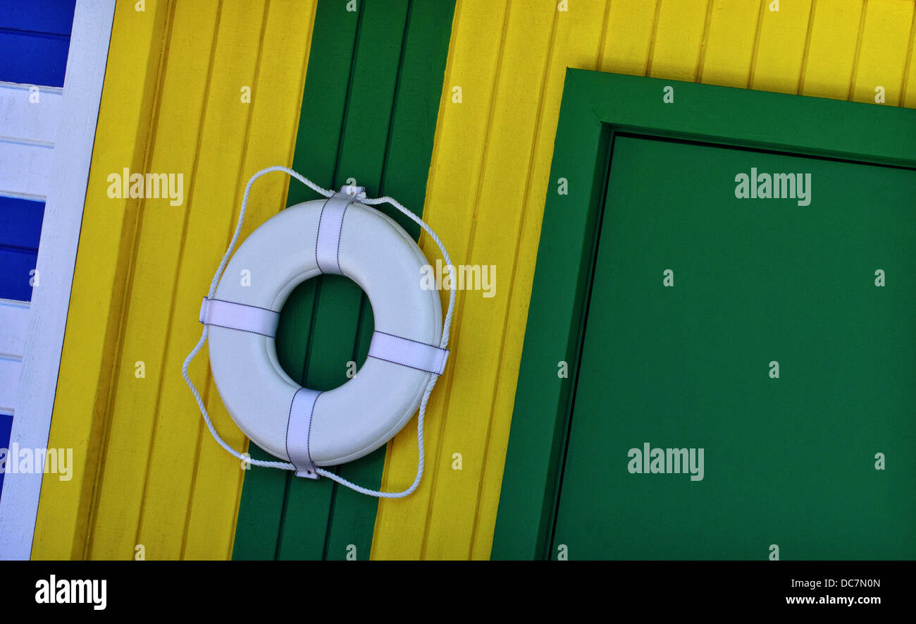 A stock image of a beach house with a life preserver Stock Photo - Alamy