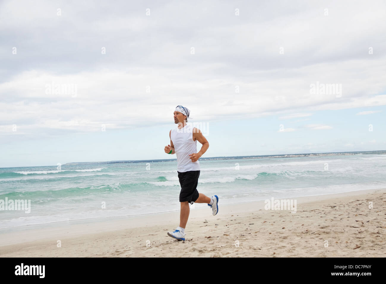 man is jogging on the beach summertime sport fitness run jogger runner ...
